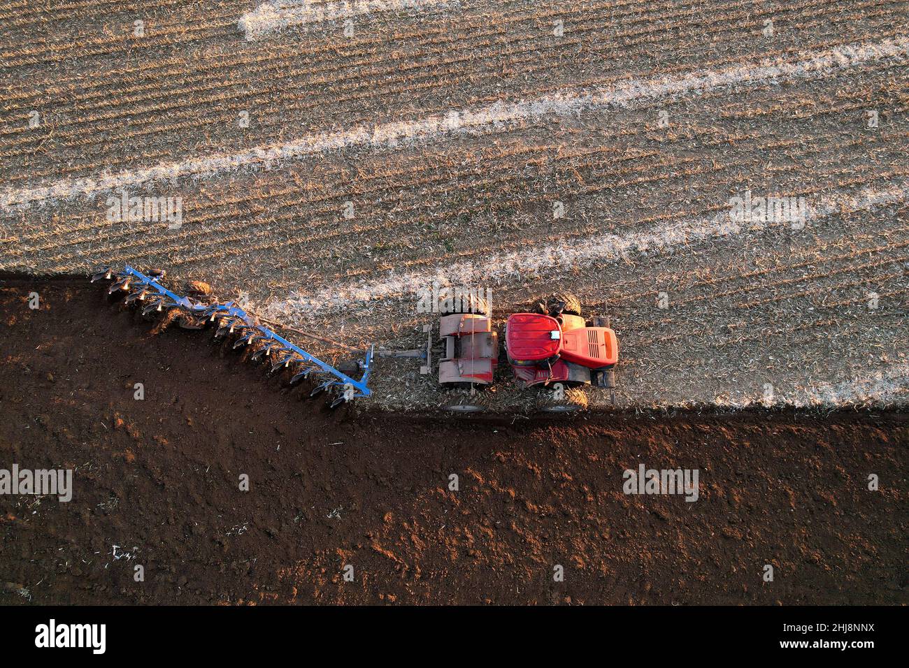 Tractor on plowed, aerial view. Ploughing and soil Tillage ...