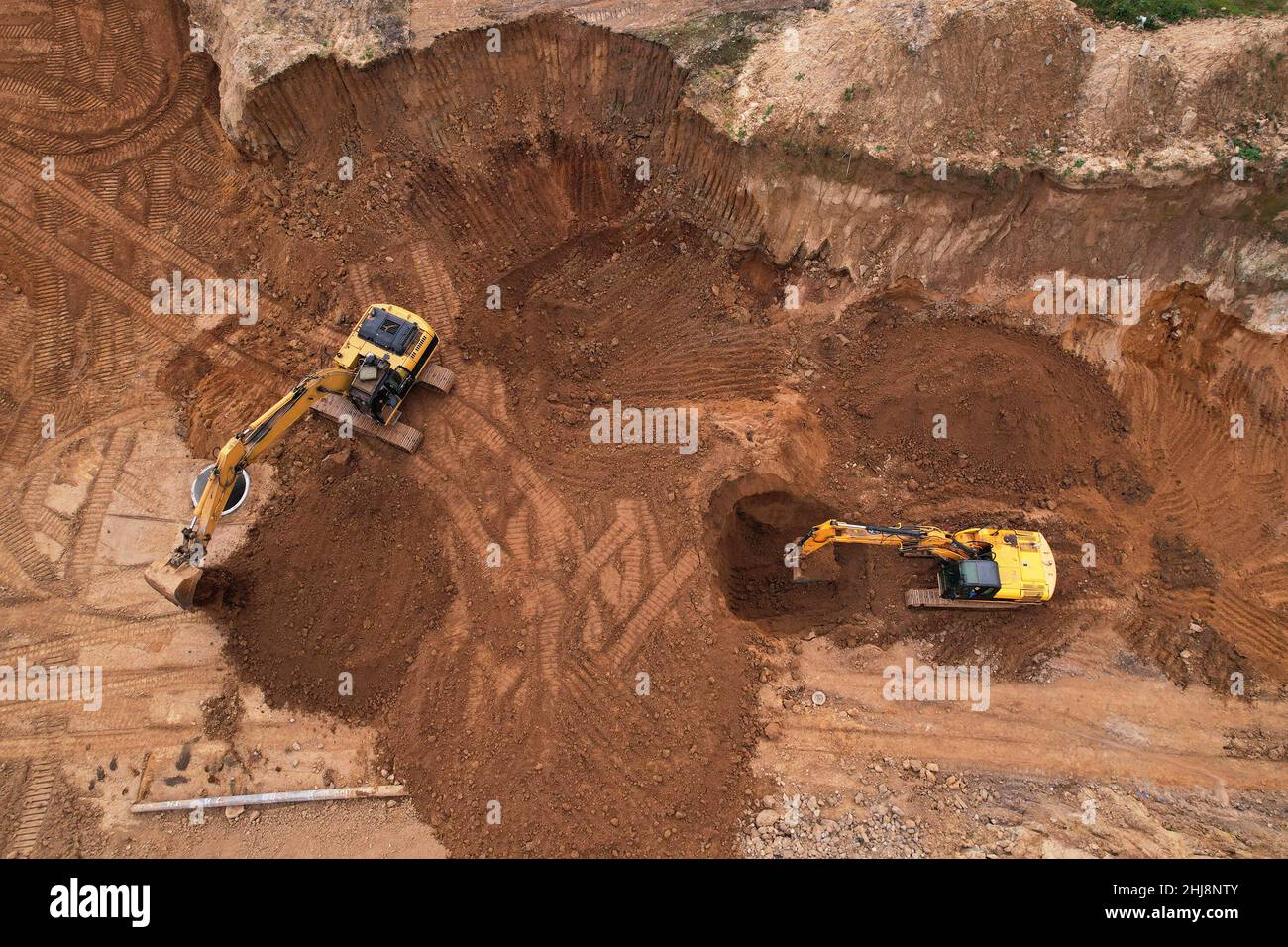 Excavator dig ground for sewerge construction. Trench for laying a ...