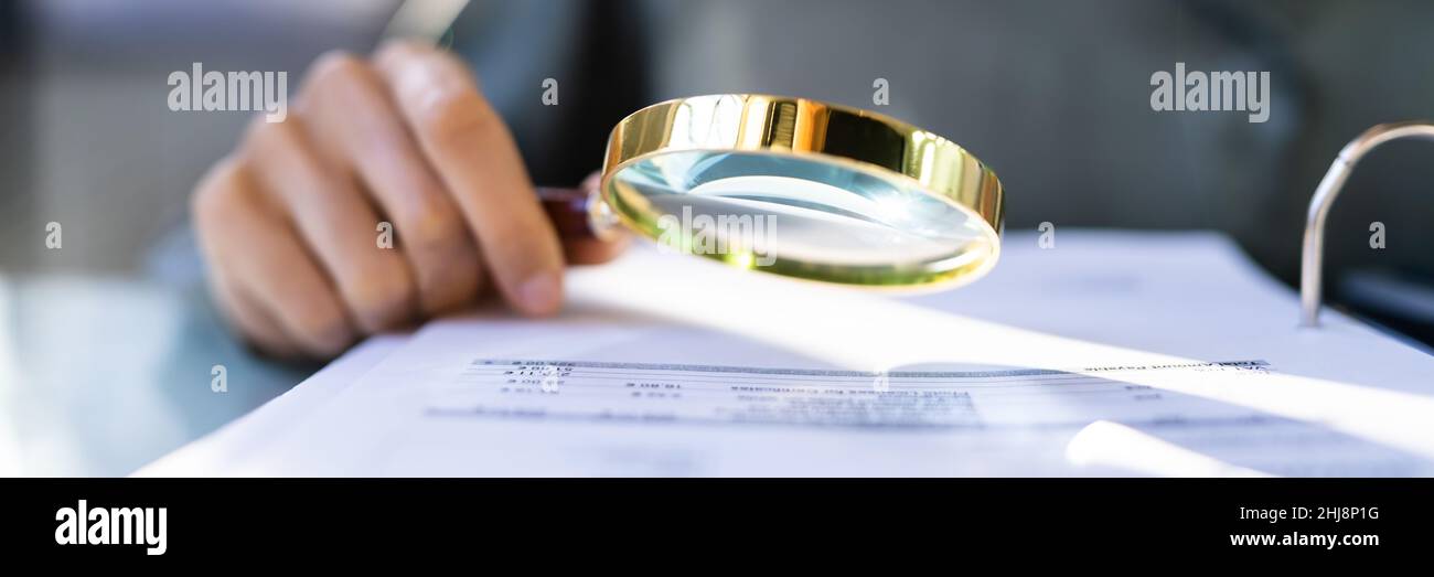 Audit And Fraud Investigation. Auditor Using Magnifying Glass On ...