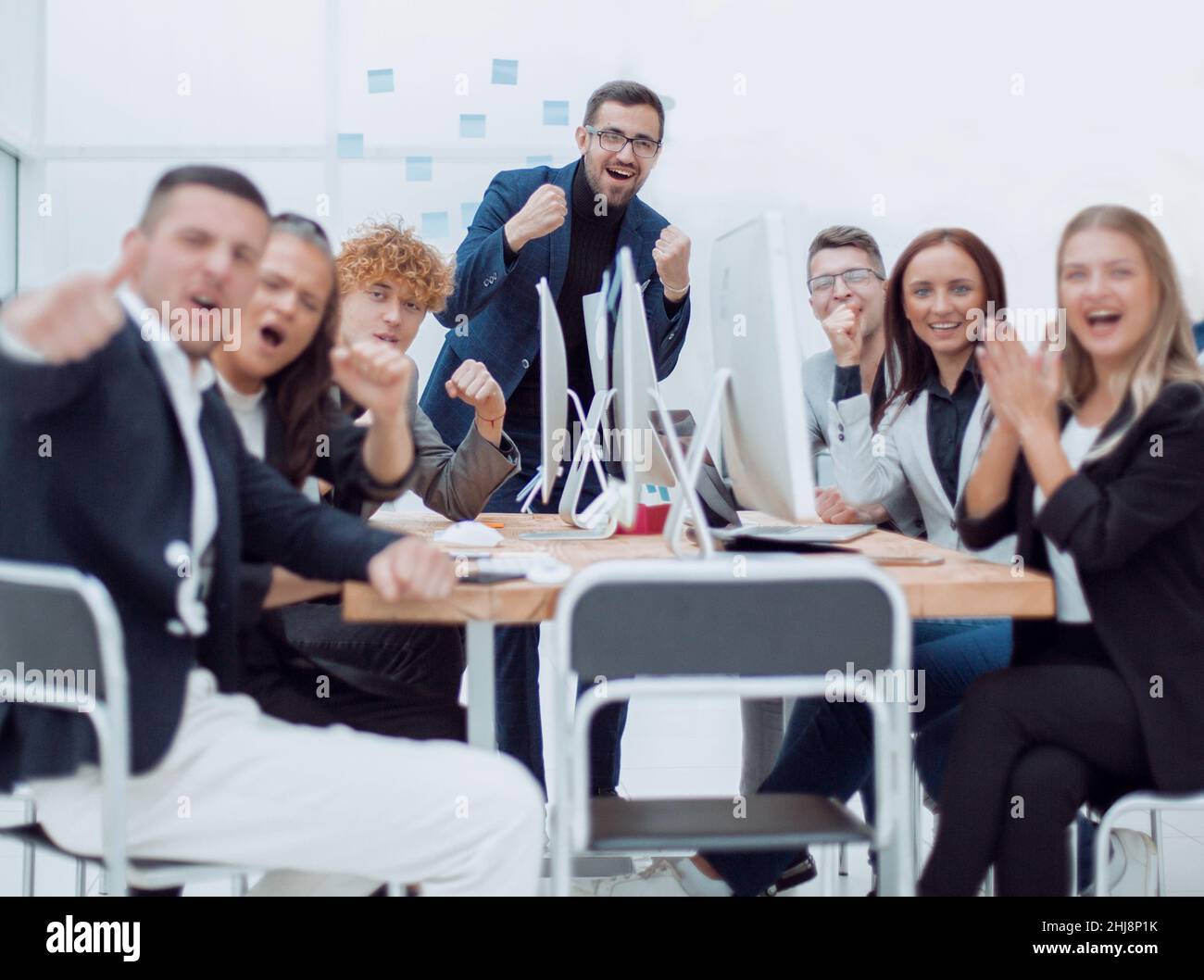 large group of happy employees sitting in conference room Stock Photo ...