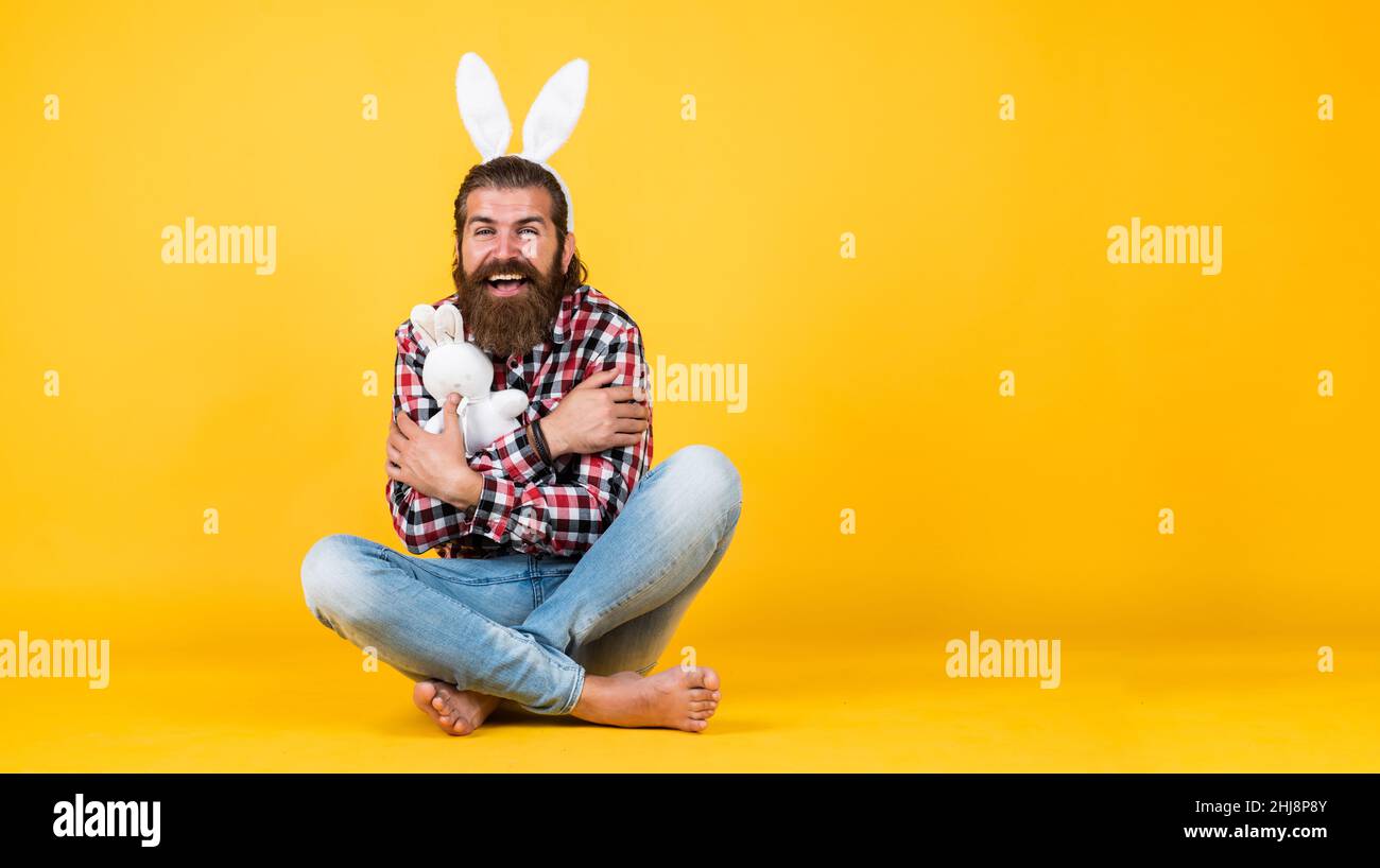 funny bearded man wear bunny ears. guy in rabbit costume having fun ...