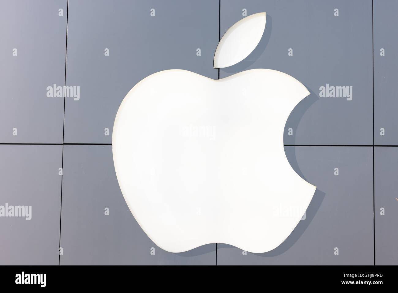American multinational technology company Apple logo and store seen in ...
