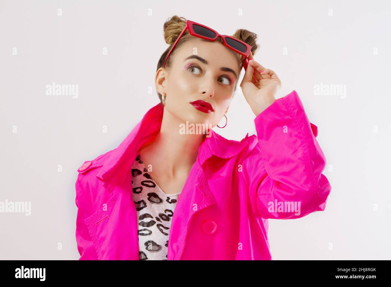 Happy, shock, excited woman face closeup. Girl in bright pink autumn ...