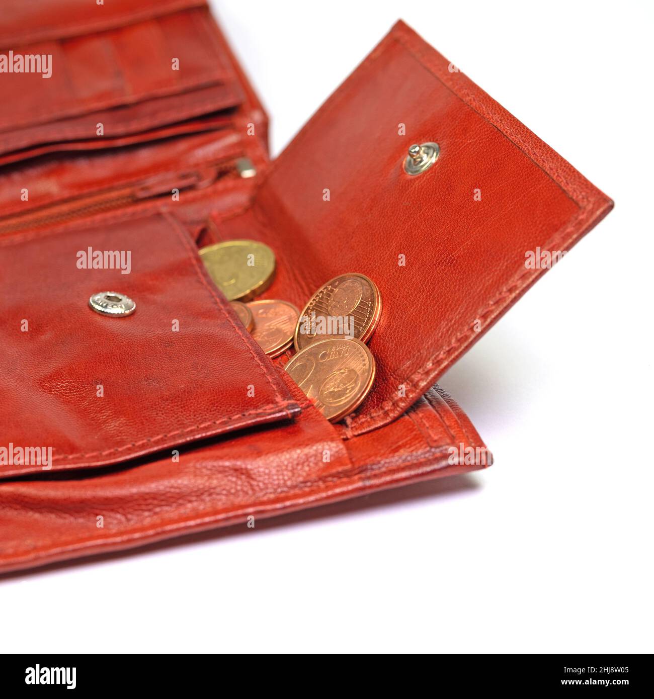 Purse with loose change against a white background Stock Photo - Alamy