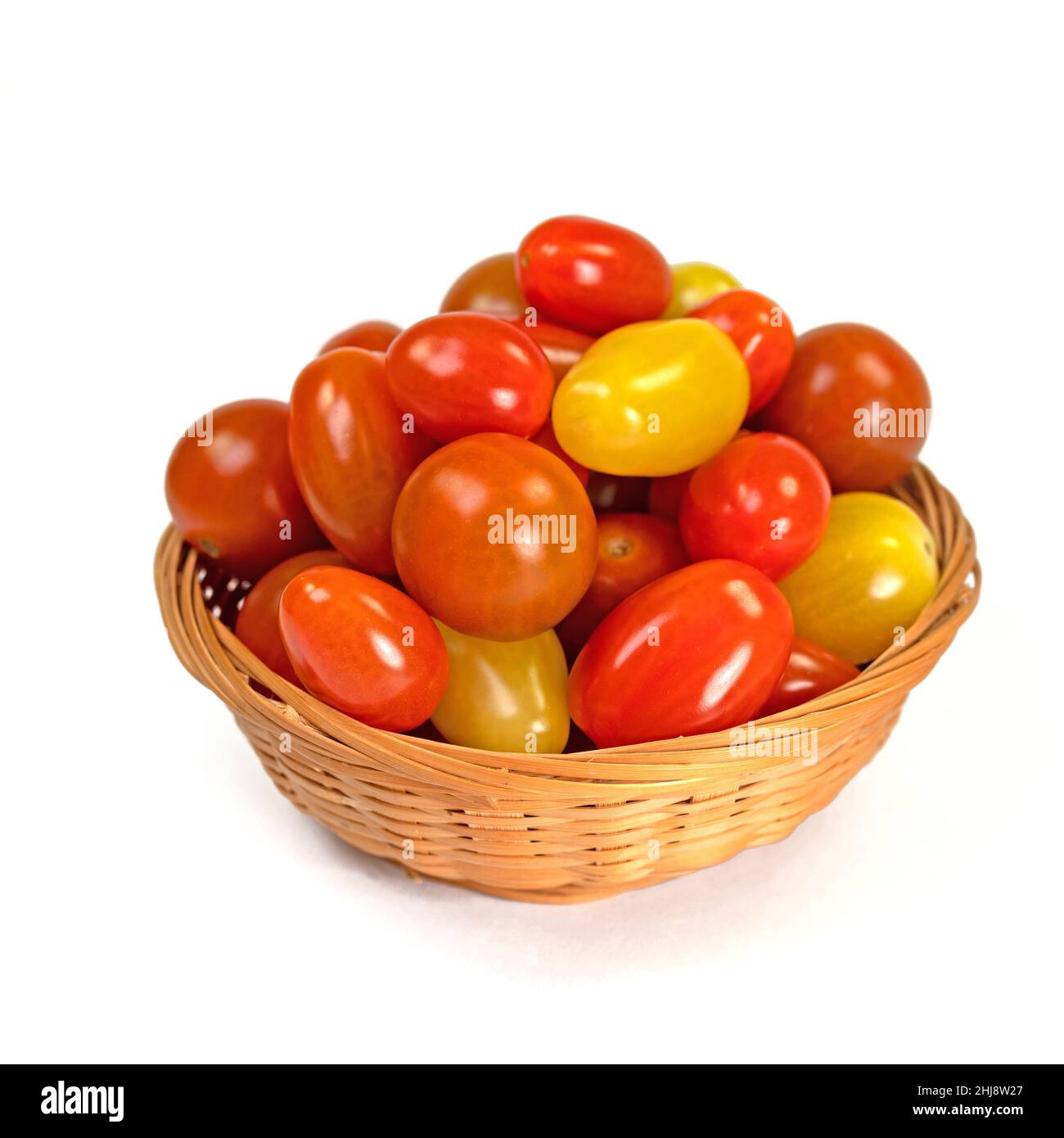 Various mini tomatoes against a white background Stock Photo - Alamy