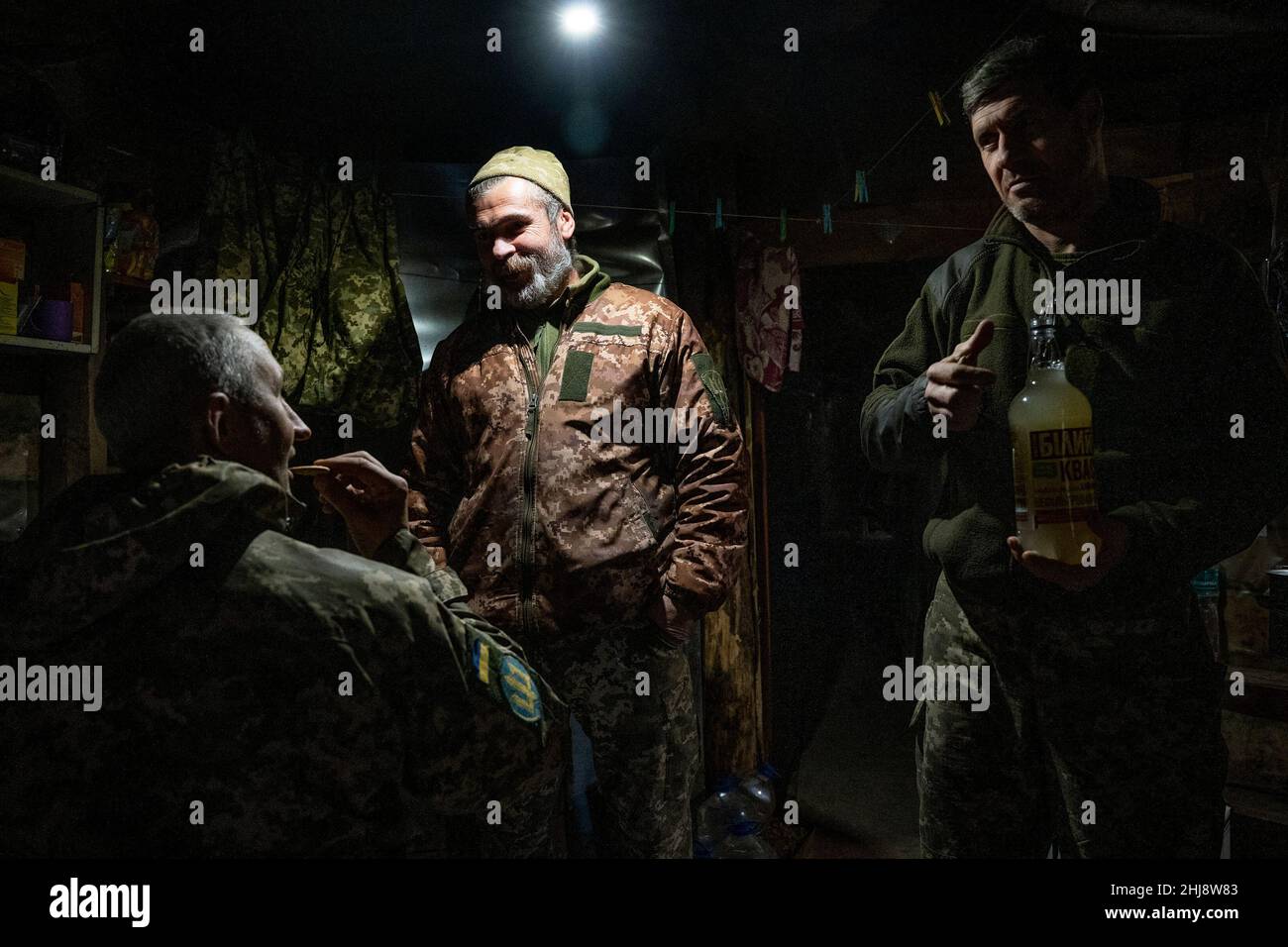 Soldiers of the Armed Forces of Ukraine rest in an underground position ...