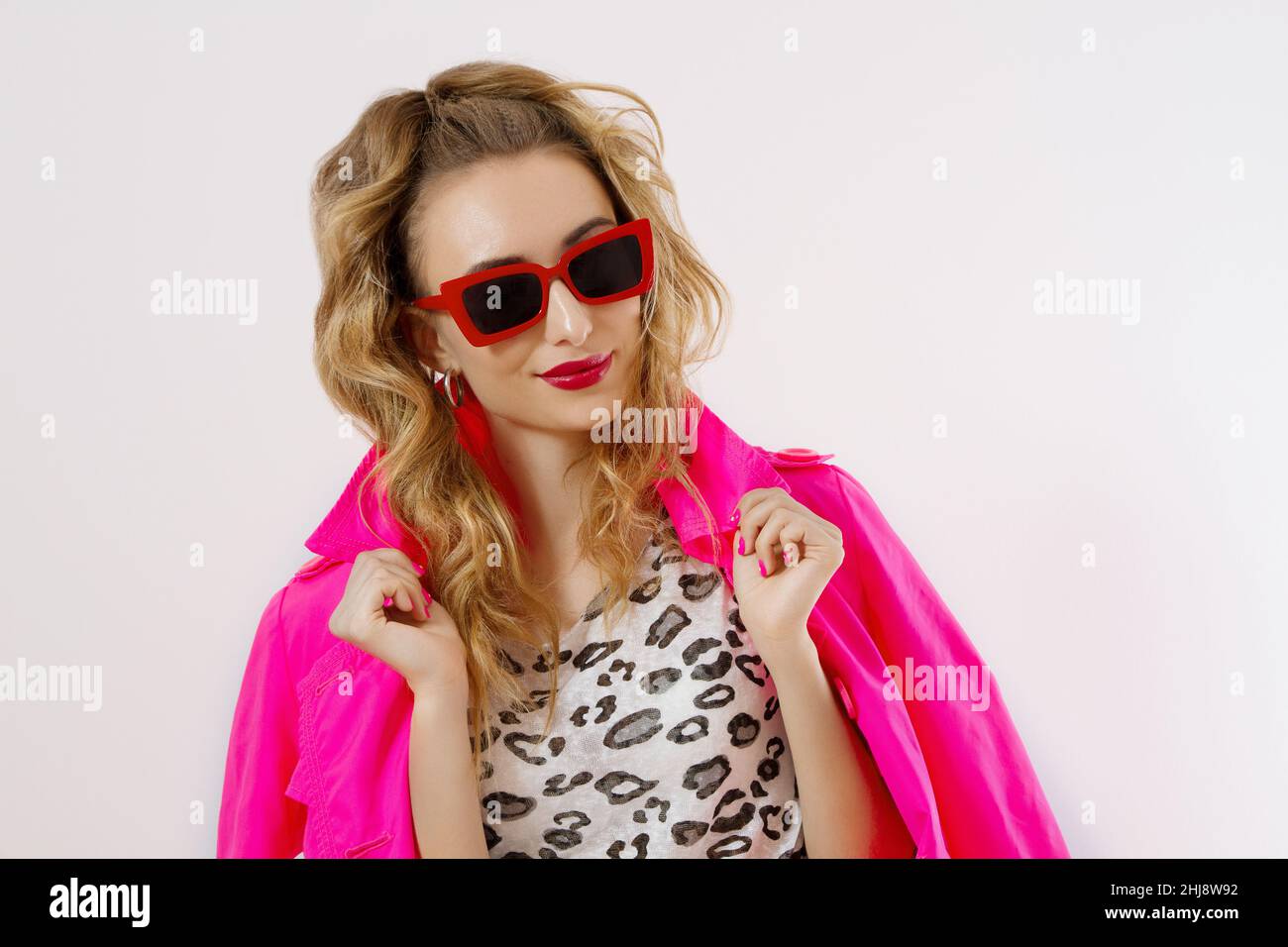 Happy, shock, excited woman face closeup. Girl in bright pink autumn ...
