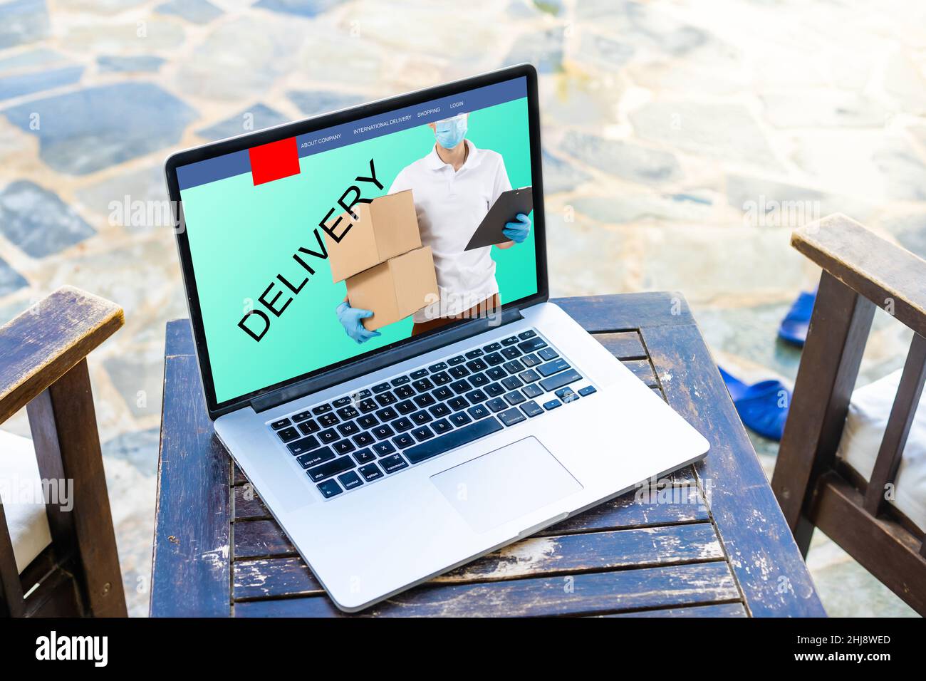 female hands on laptop computer with parcel delivery application on ...