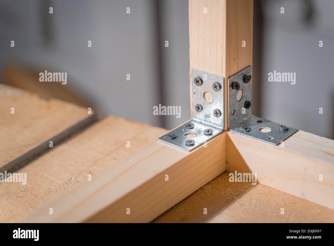 Corner connection of wooden bars with iron corners and black self ...