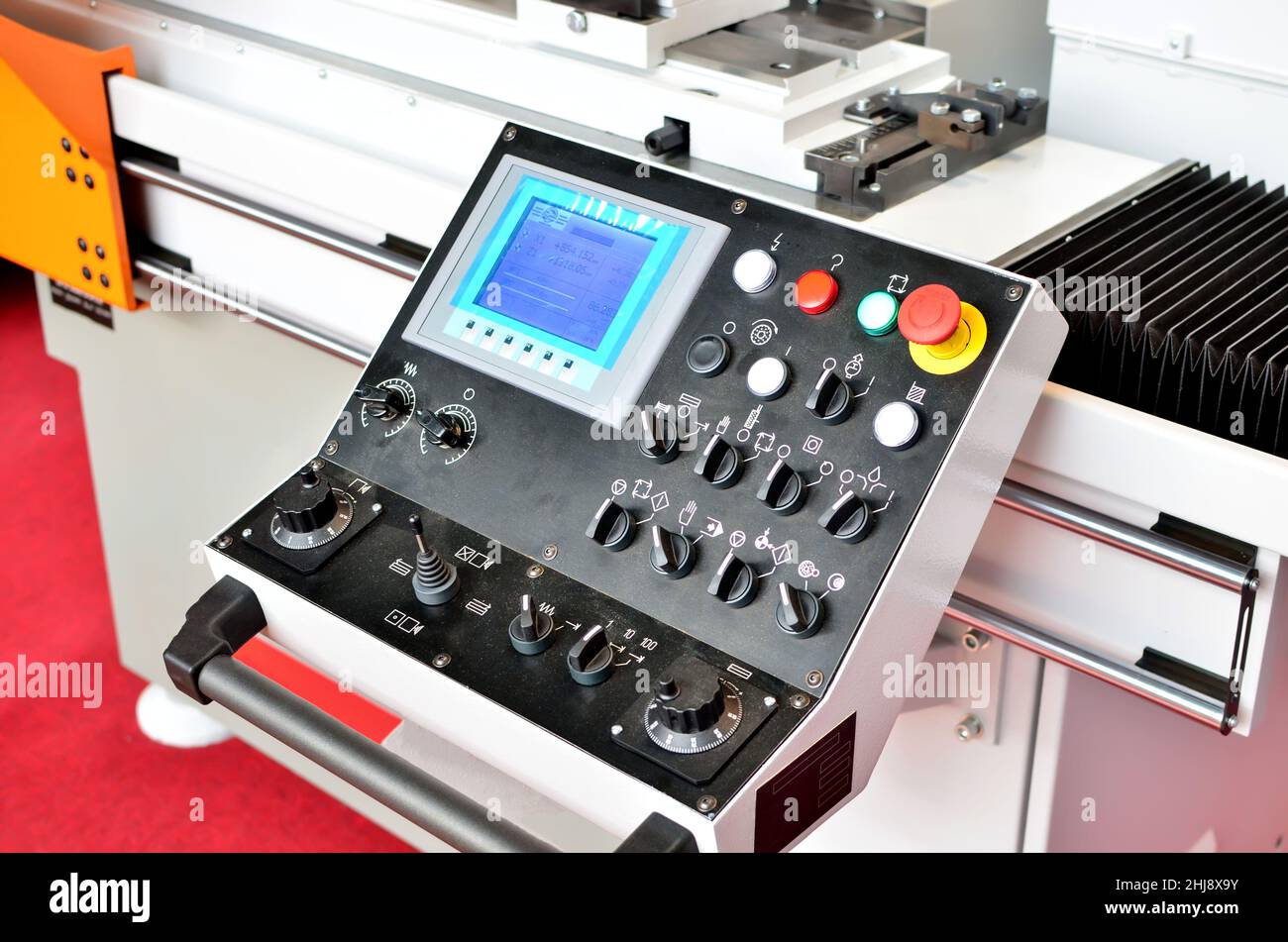 Electronic computer control panel of an industrial CNC machine tool for metalworking. Blurred ...