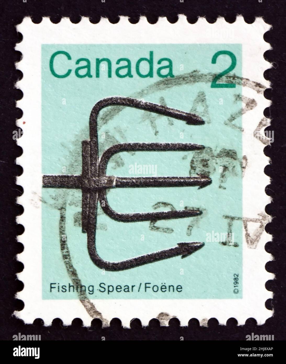 CANADA - CIRCA 1982: a stamp printed in the Canada shows Fishing Spear ...