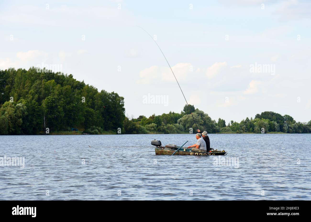 Sunset lake male fisher using hi-res stock photography and images - Alamy
