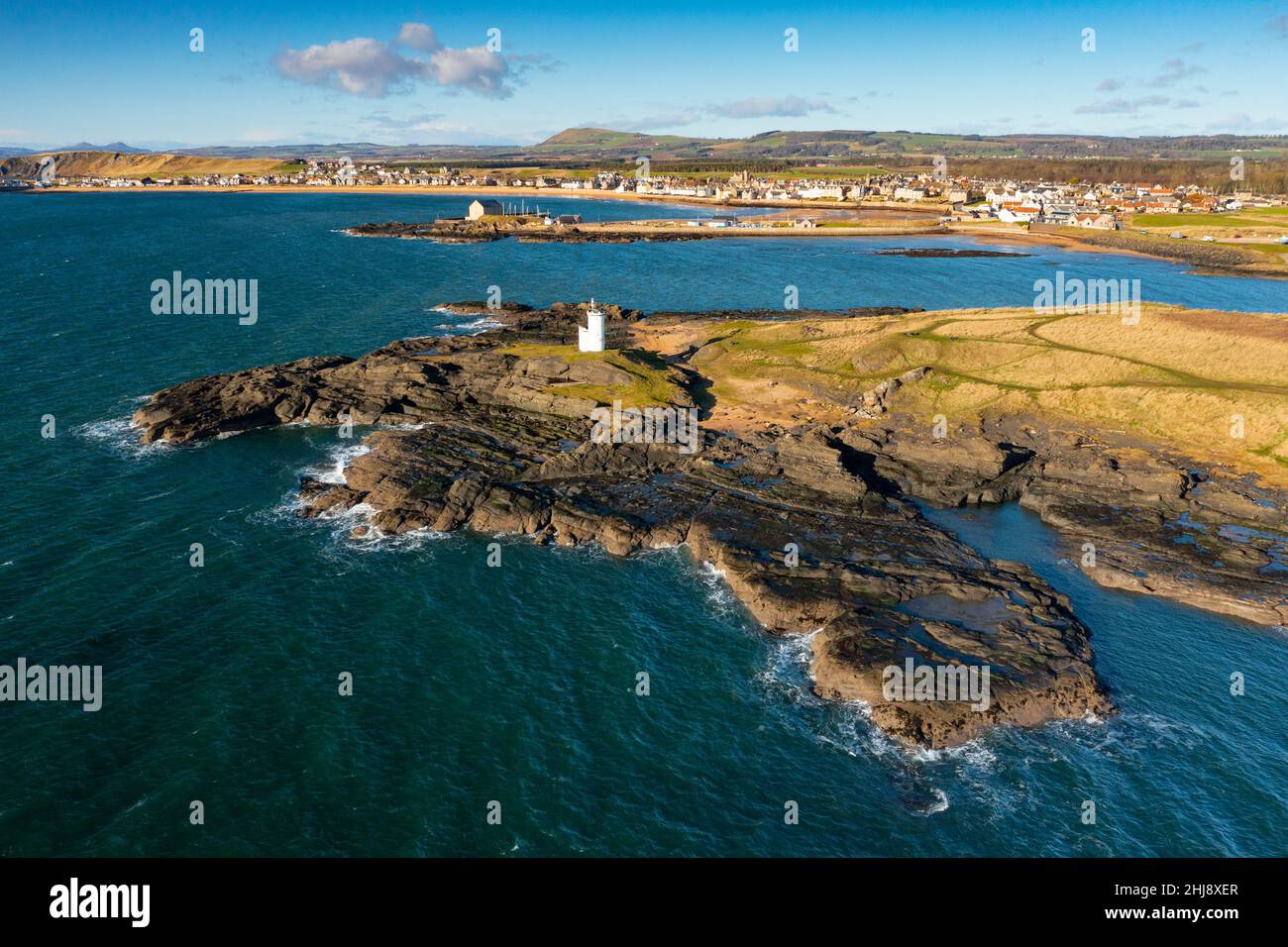 Aerial view from drone of Elie Ness Lighthouse and in distance Elie and ...