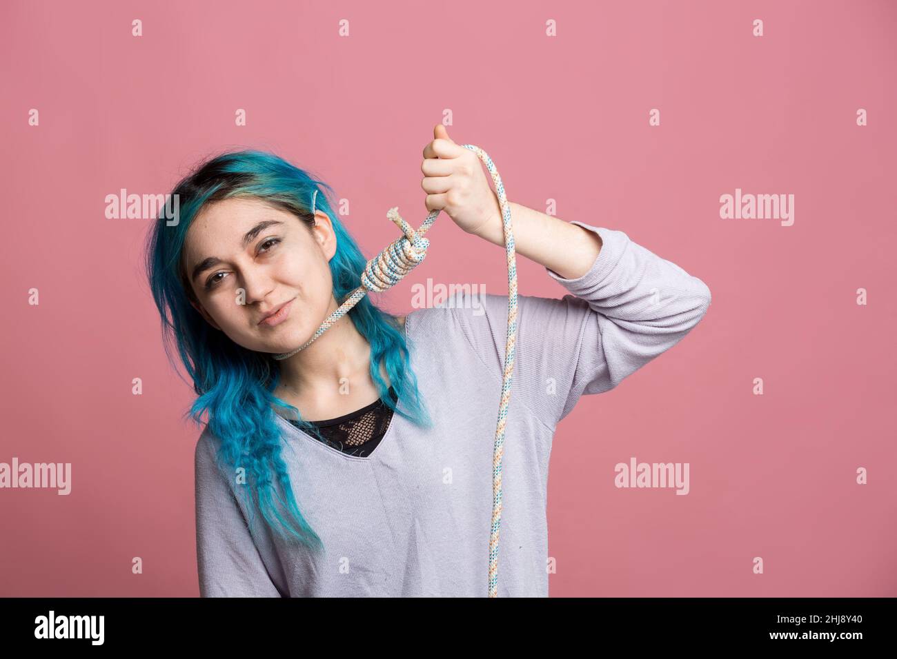 young girl with rope and hangman's knot Stock Photo - Alamy