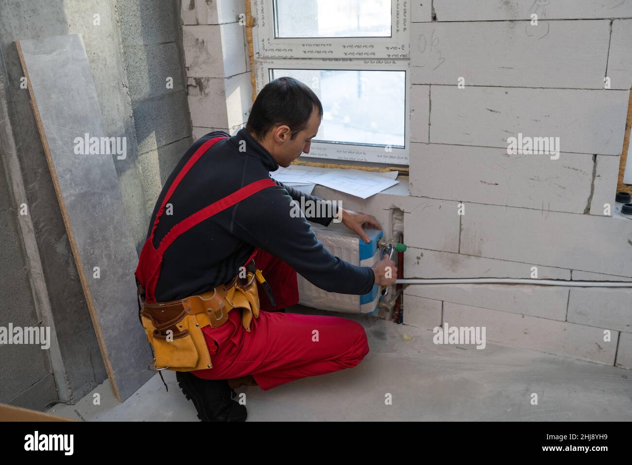 Builder handyman with construction tools. House renovation background ...