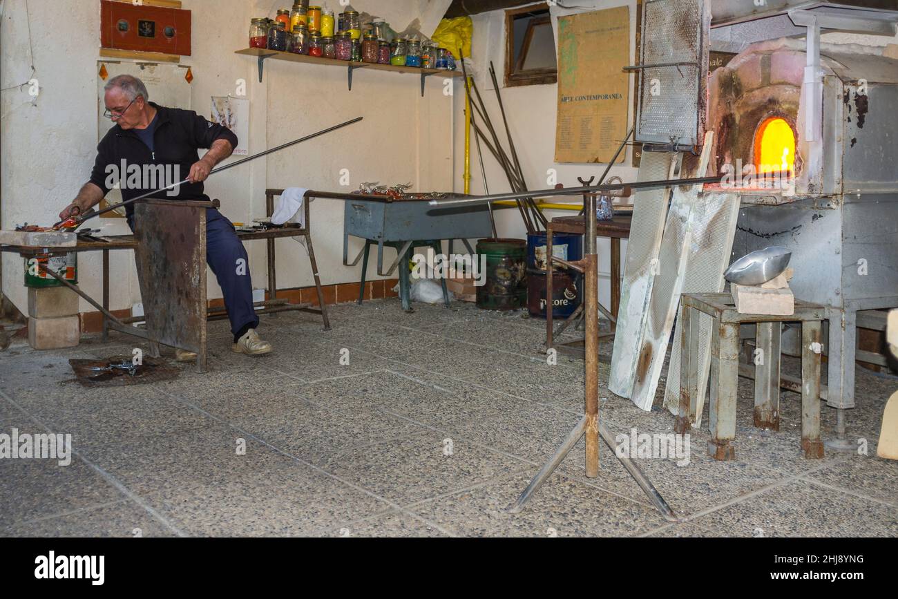 Murano, Italy - November 2, 2012: A master glass-maker at work in his ...
