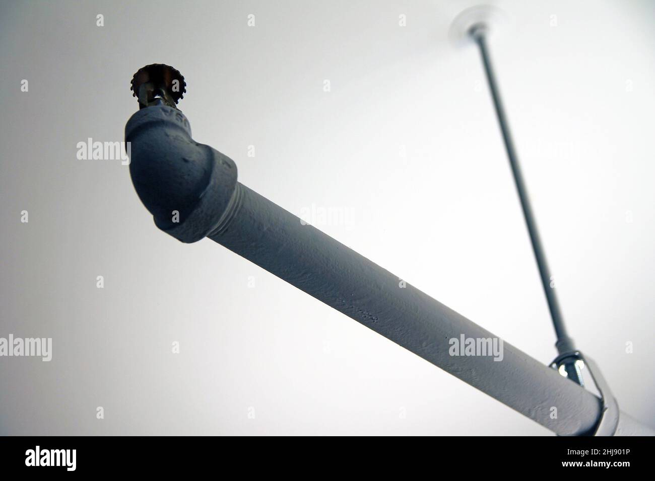The end of the water tube with the sprinkler hanging on the ceiling in ...