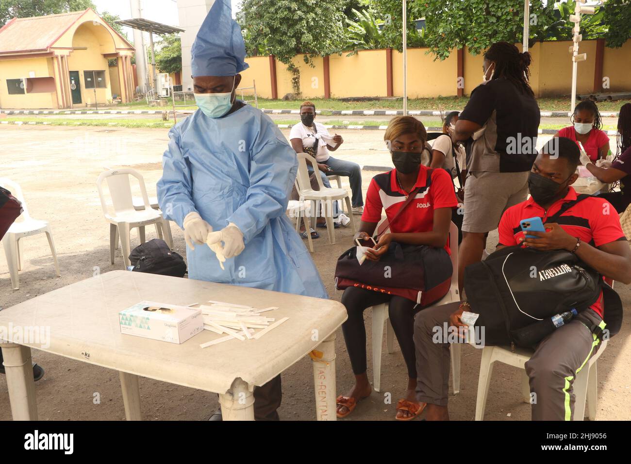 A healthcare worker wearing personal protective equipment (PPE ...