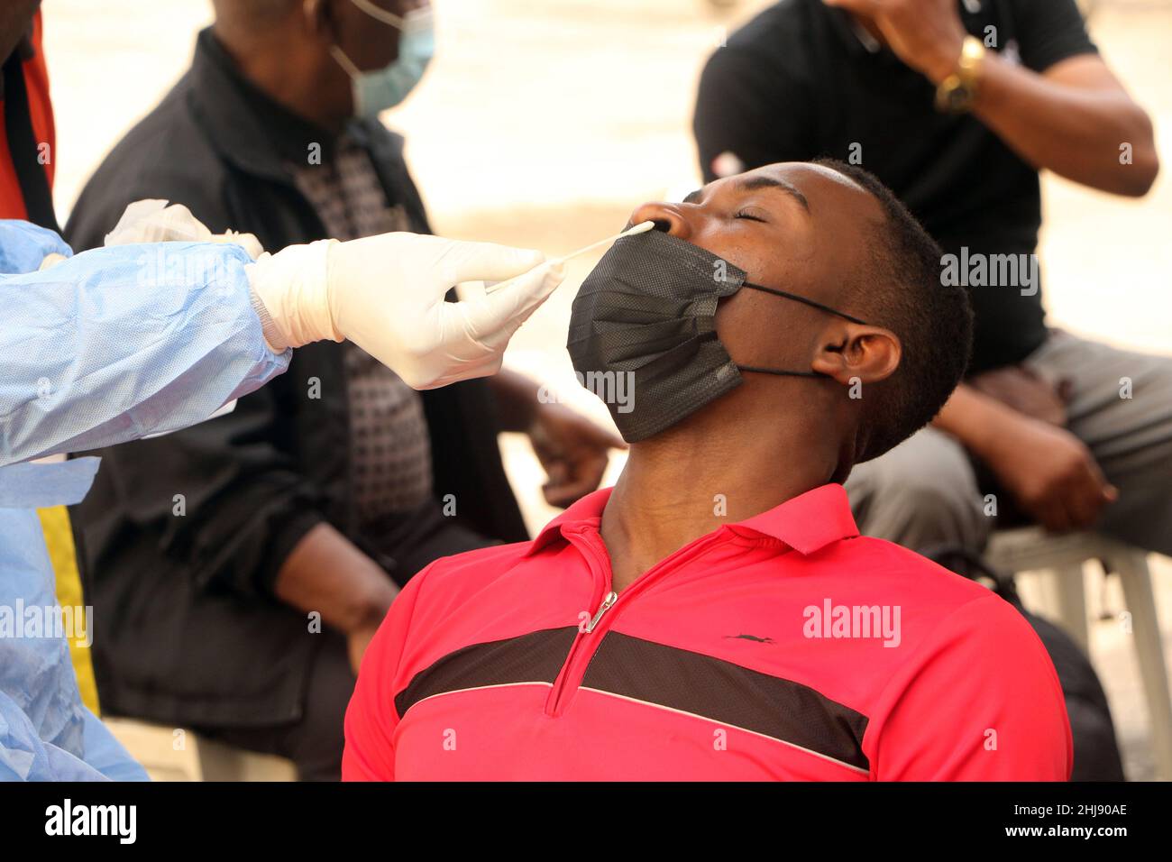A healthcare worker wearing personal protective equipment (PPE ...