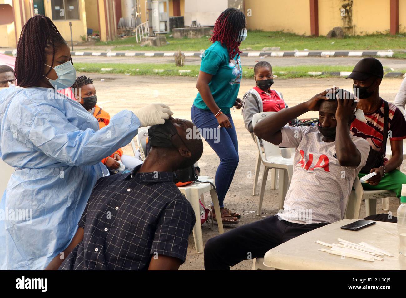 A healthcare worker wearing personal protective equipment (PPE ...