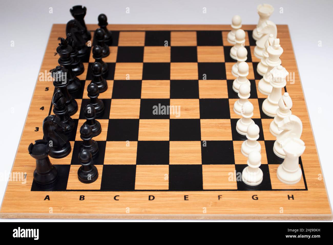 Chess teams on the chessboard Stock Photo - Alamy