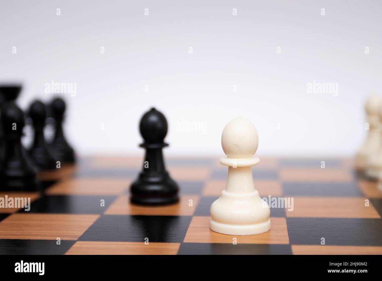 The beginning of a game of chess. Chess is placed on a chessboard Stock ...