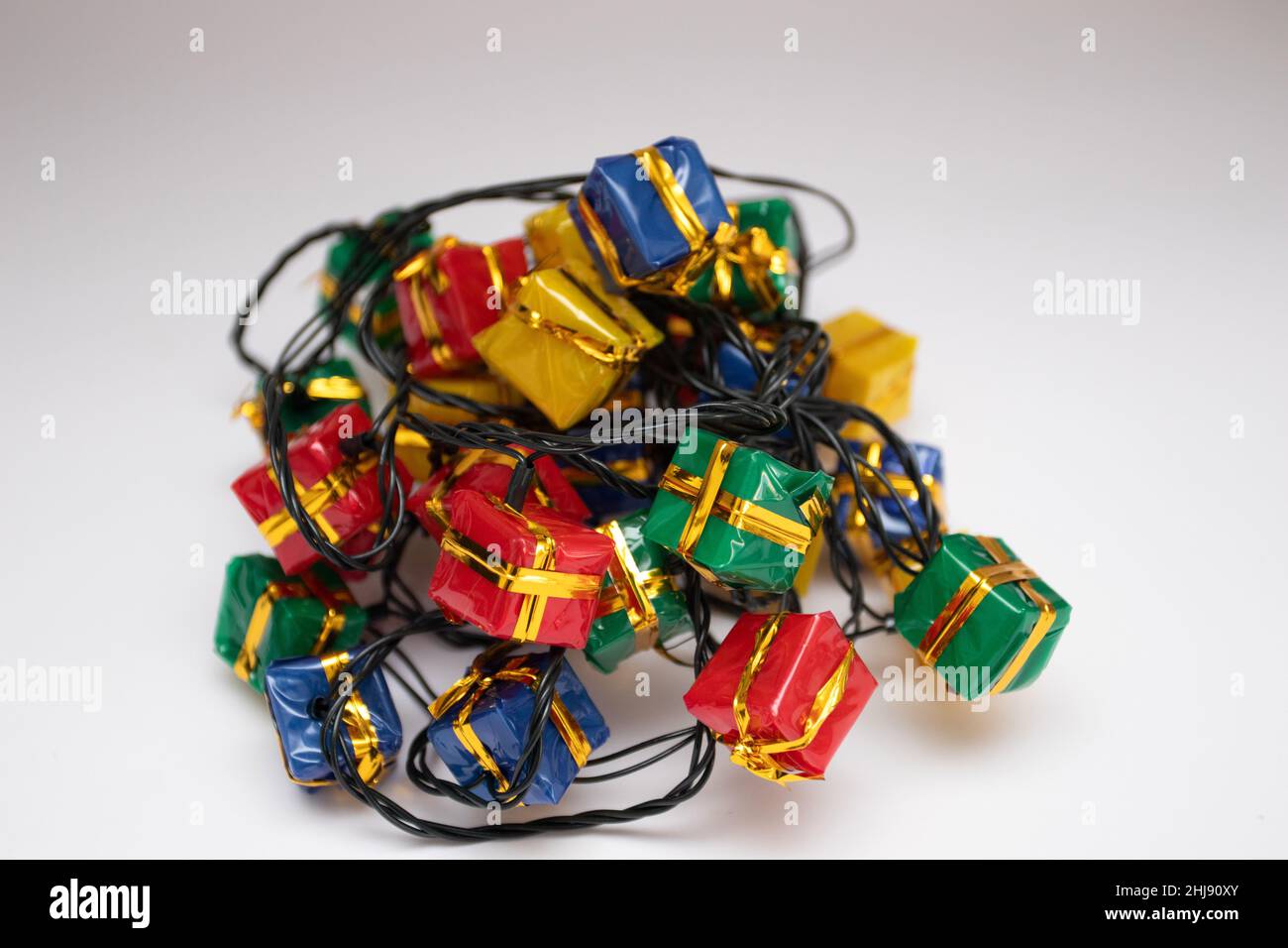 Christmas electric garland on white background Stock Photo - Alamy