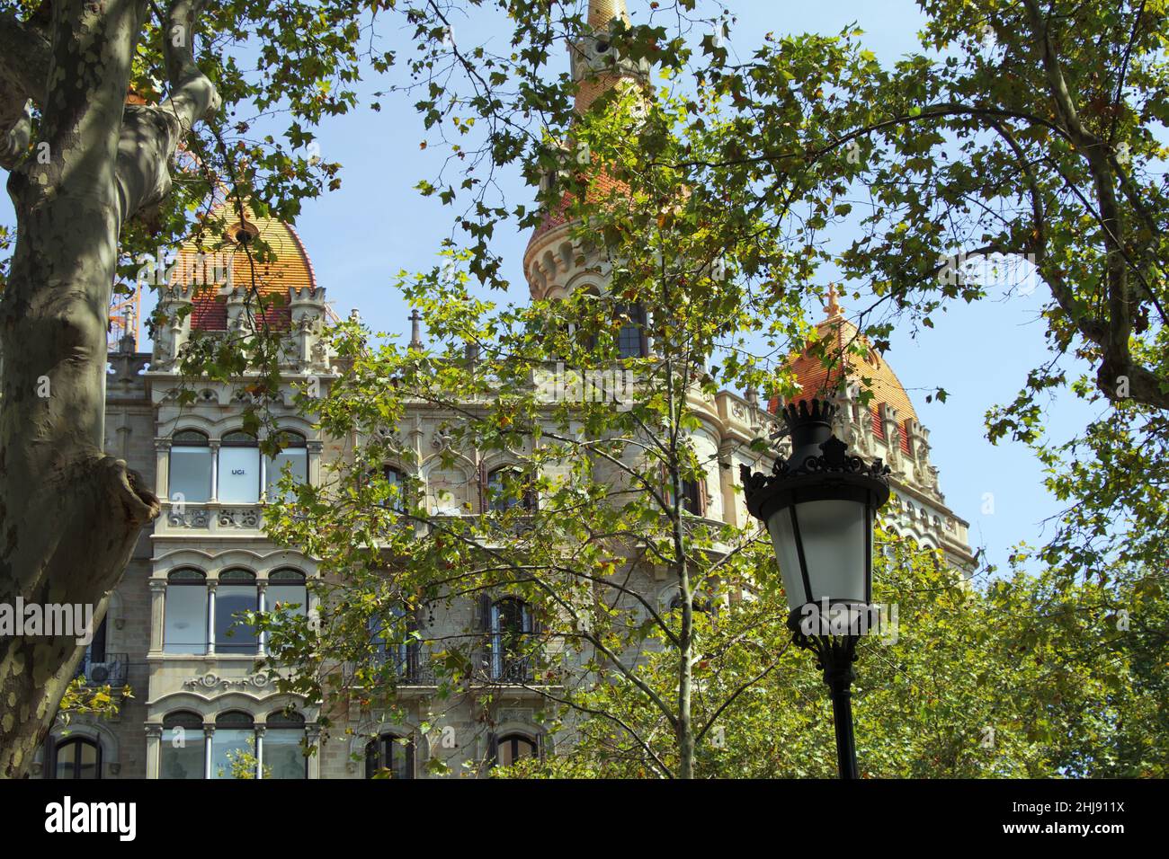 BARCELONA, SPAIN – AUGUST 23, 2019: Cases Rocamora covered with trees ...
