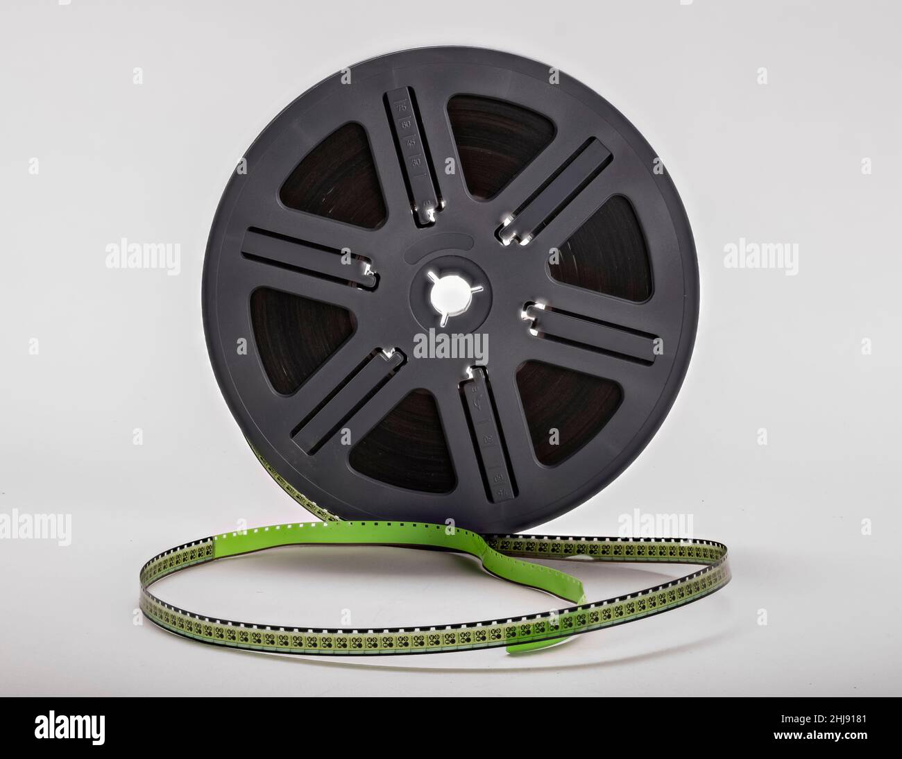 A Kodachrome Super-8 film with audio track coiled on a plastic film ...