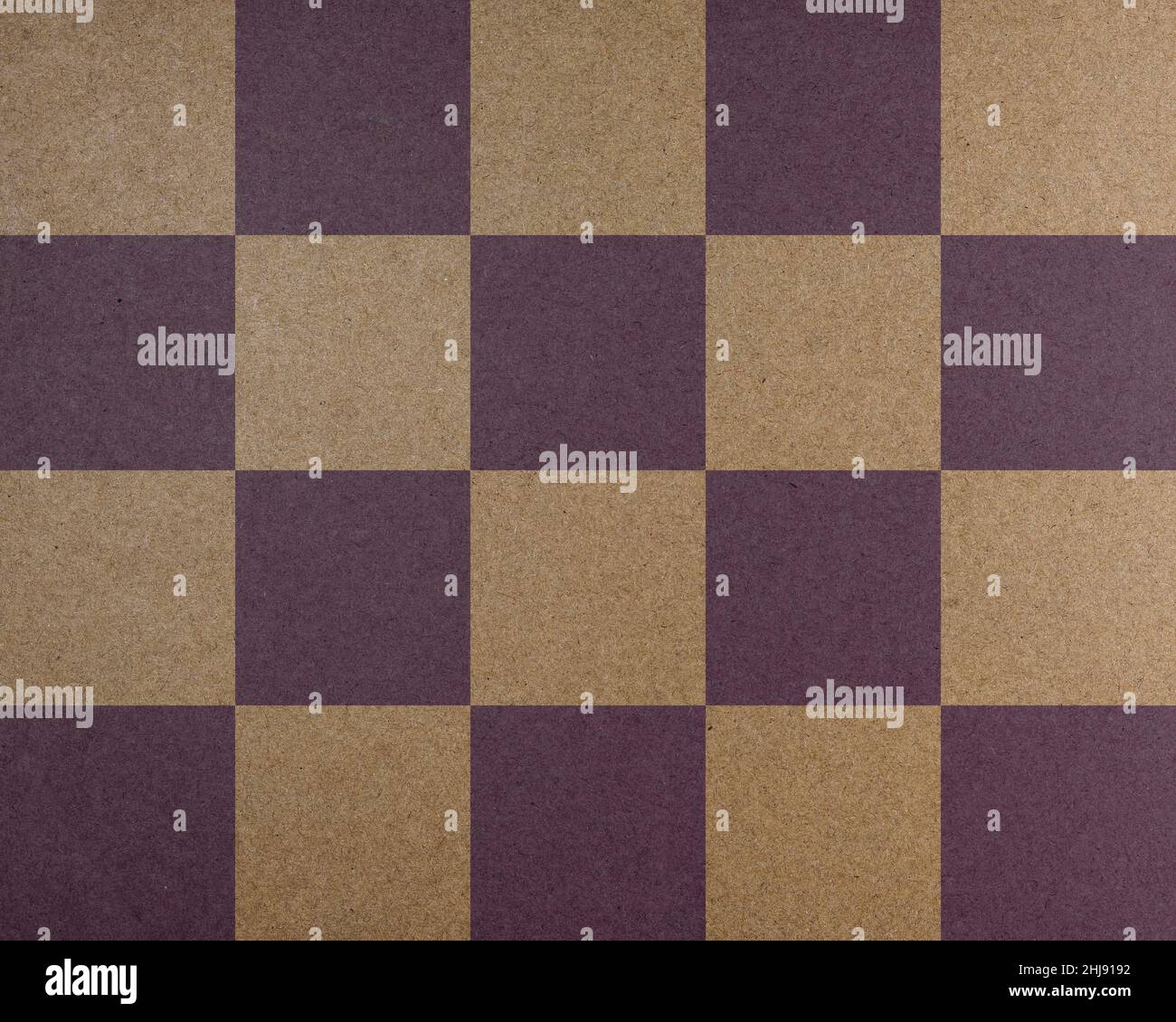 surface of paperboard made from brown fibers with a checkerboard ...