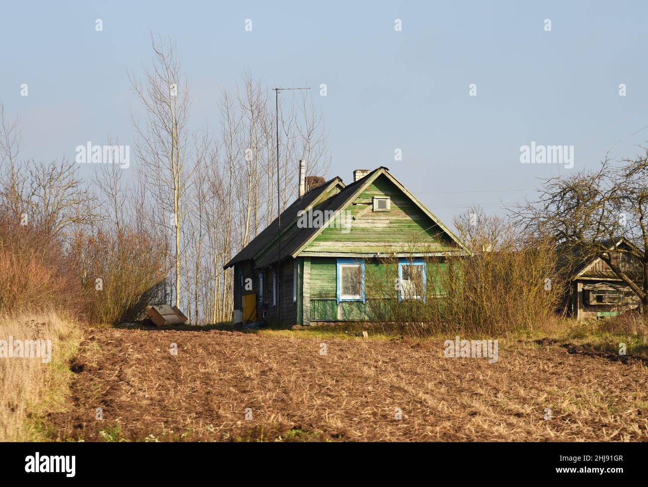 Old wooden house in the country in the garden. Home in rural area ...