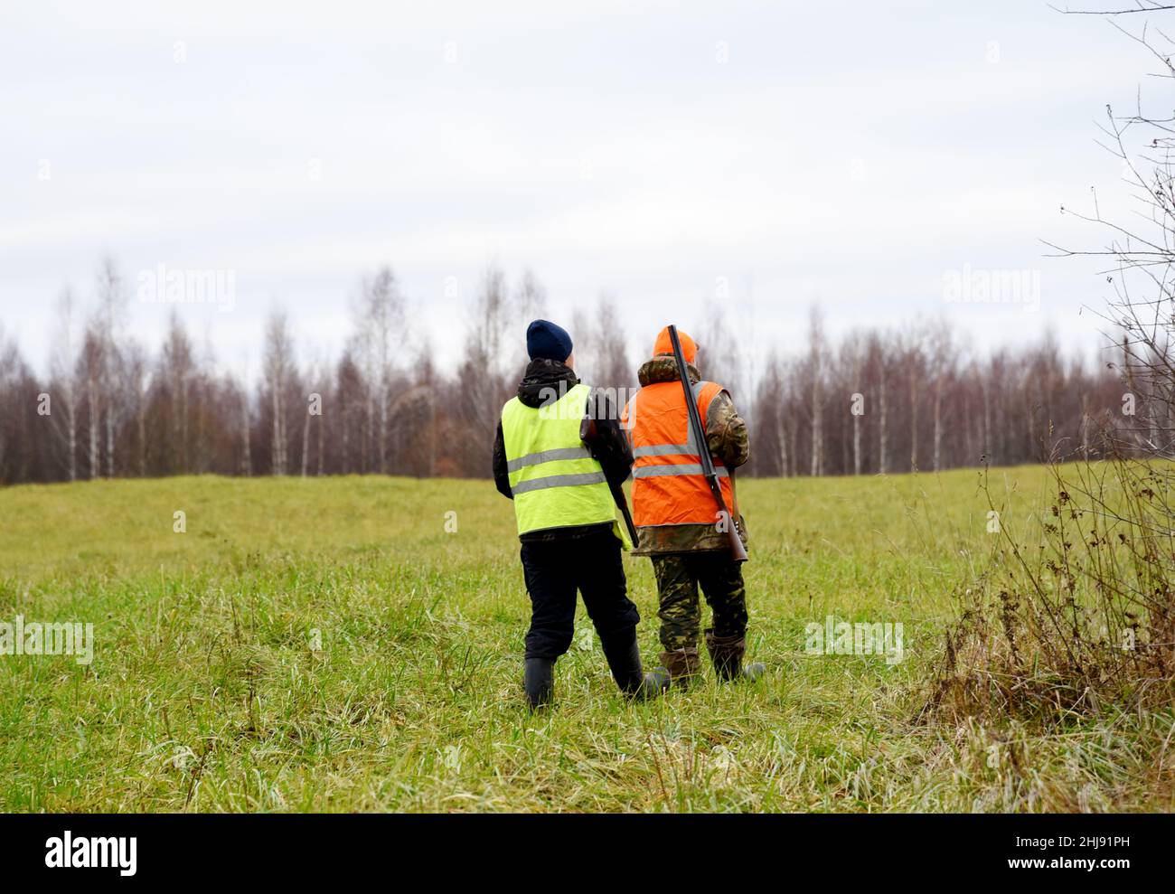 Hunter during hunting in forest. Hunters with gun and rifle. Hunter ...