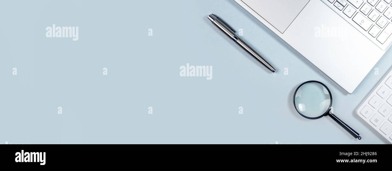Business and technology banner with laptop, calculator, magnifier and ...