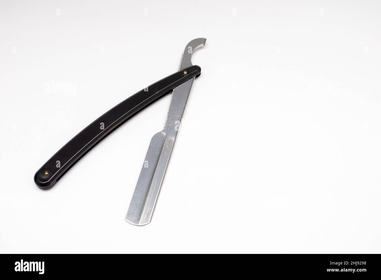 Black straight razor on a white background Stock Photo - Alamy