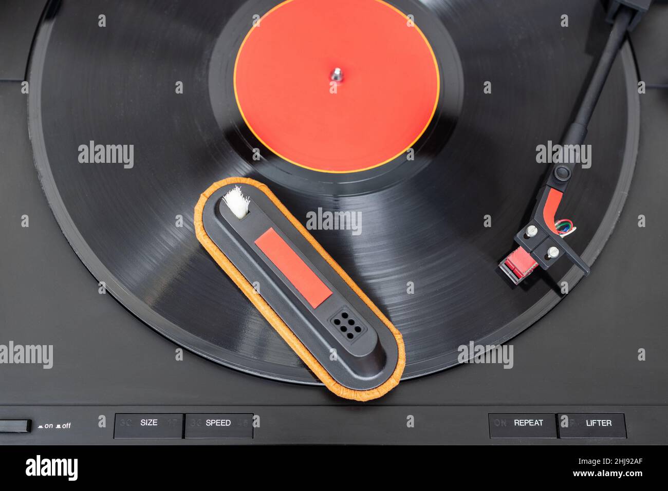 Cleaning tool on vinyl record. Cleaning concept Stock Photo - Alamy