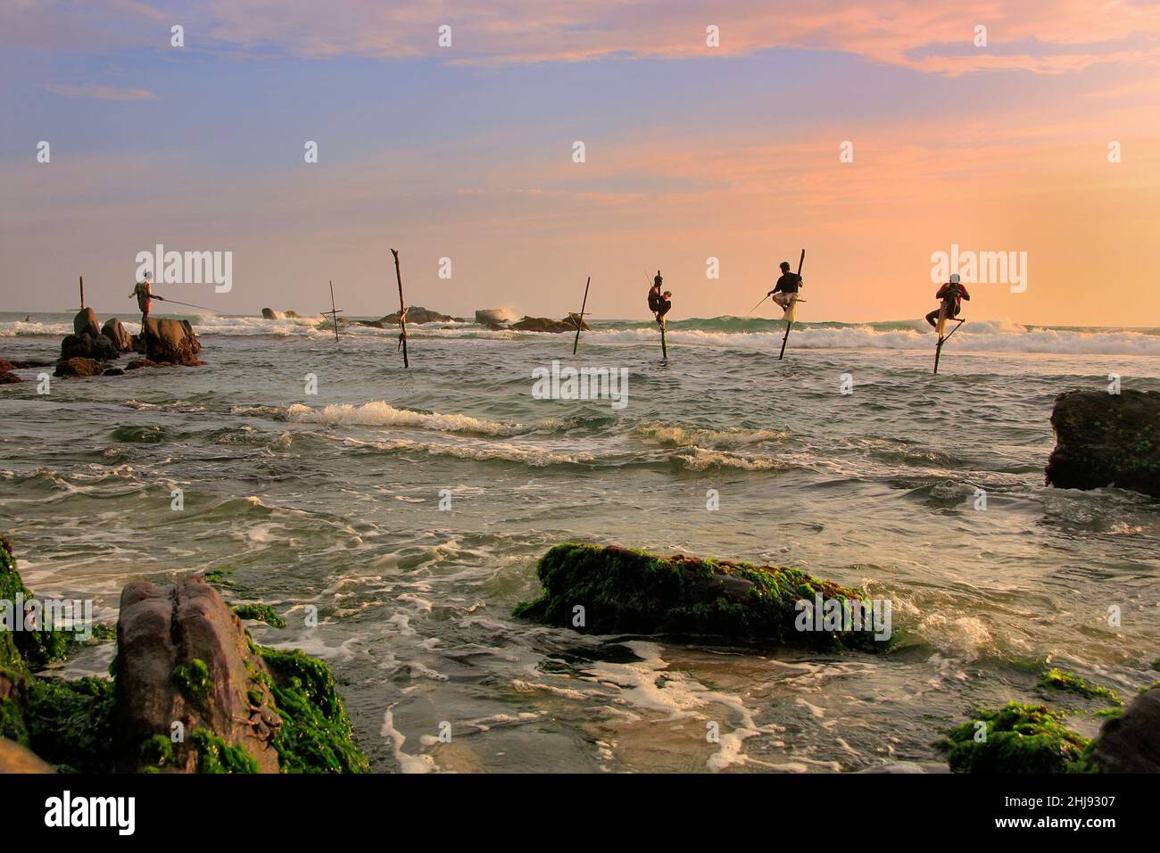 Famous stick fishermen in Unawatuna, Sri Lanka Stock Photo - Alamy