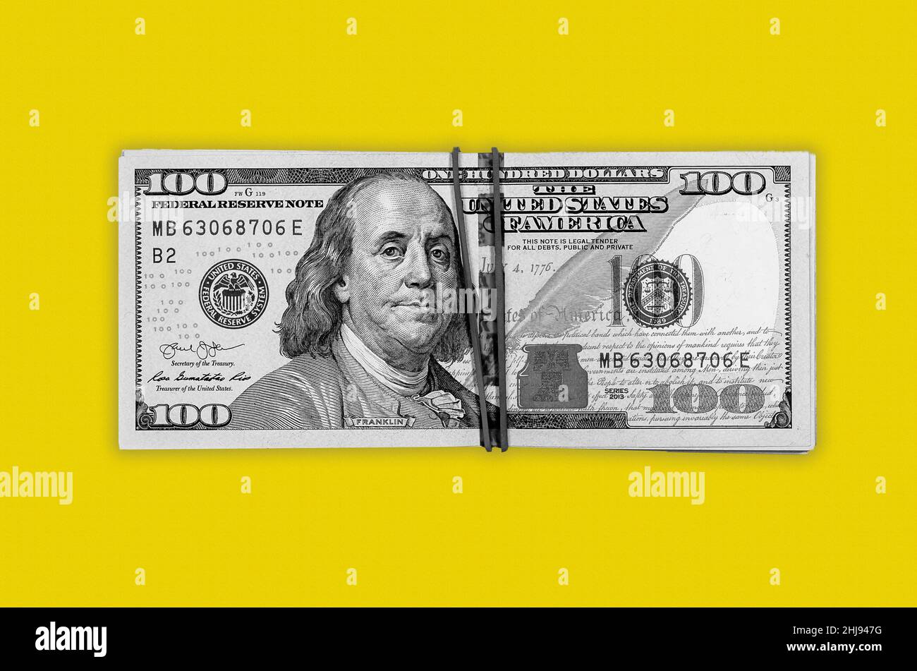 Gray dollar cash banknotes on yellow background Stock Photo - Alamy