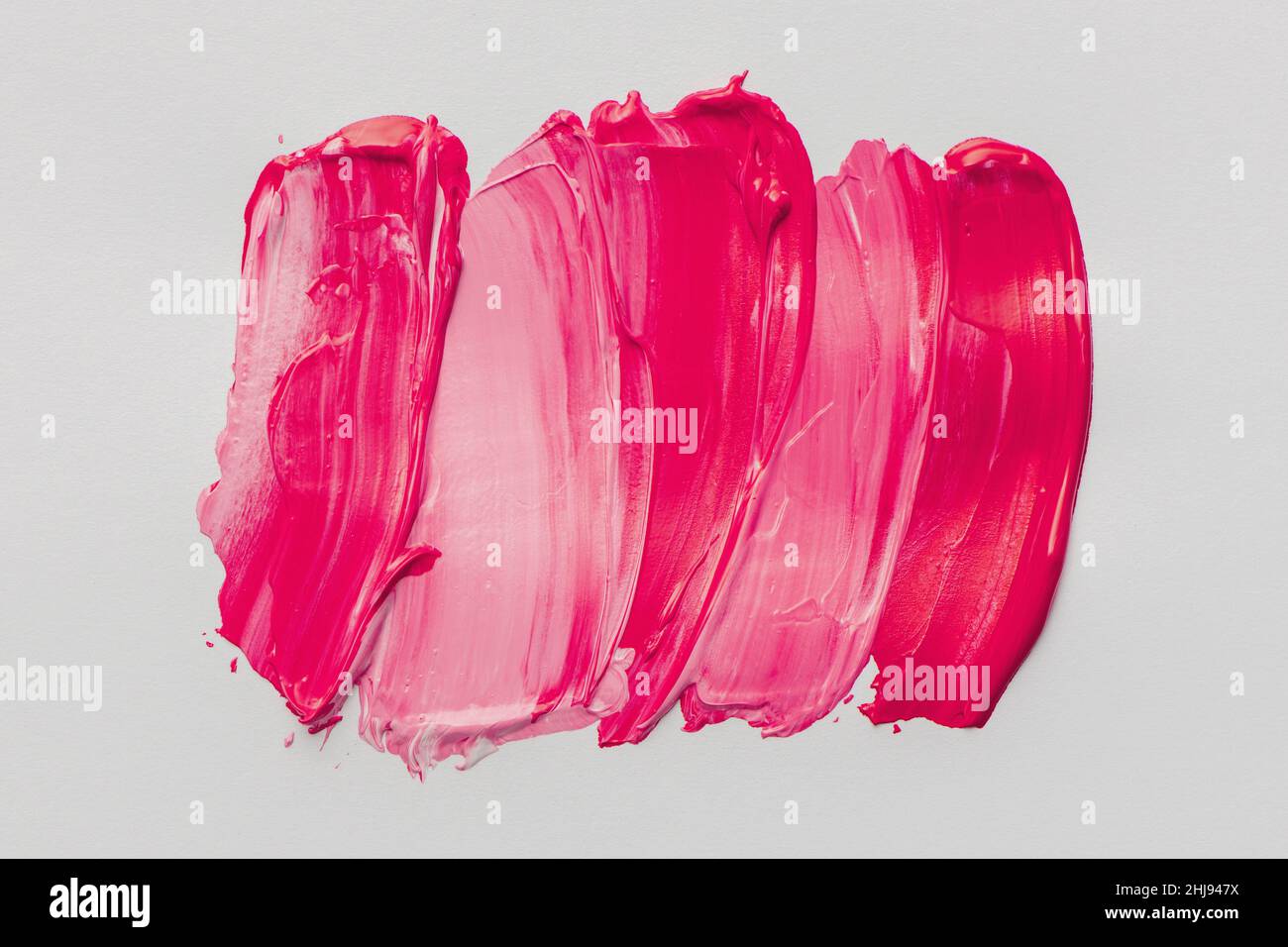 Pink brush strokes on white background Stock Photo - Alamy