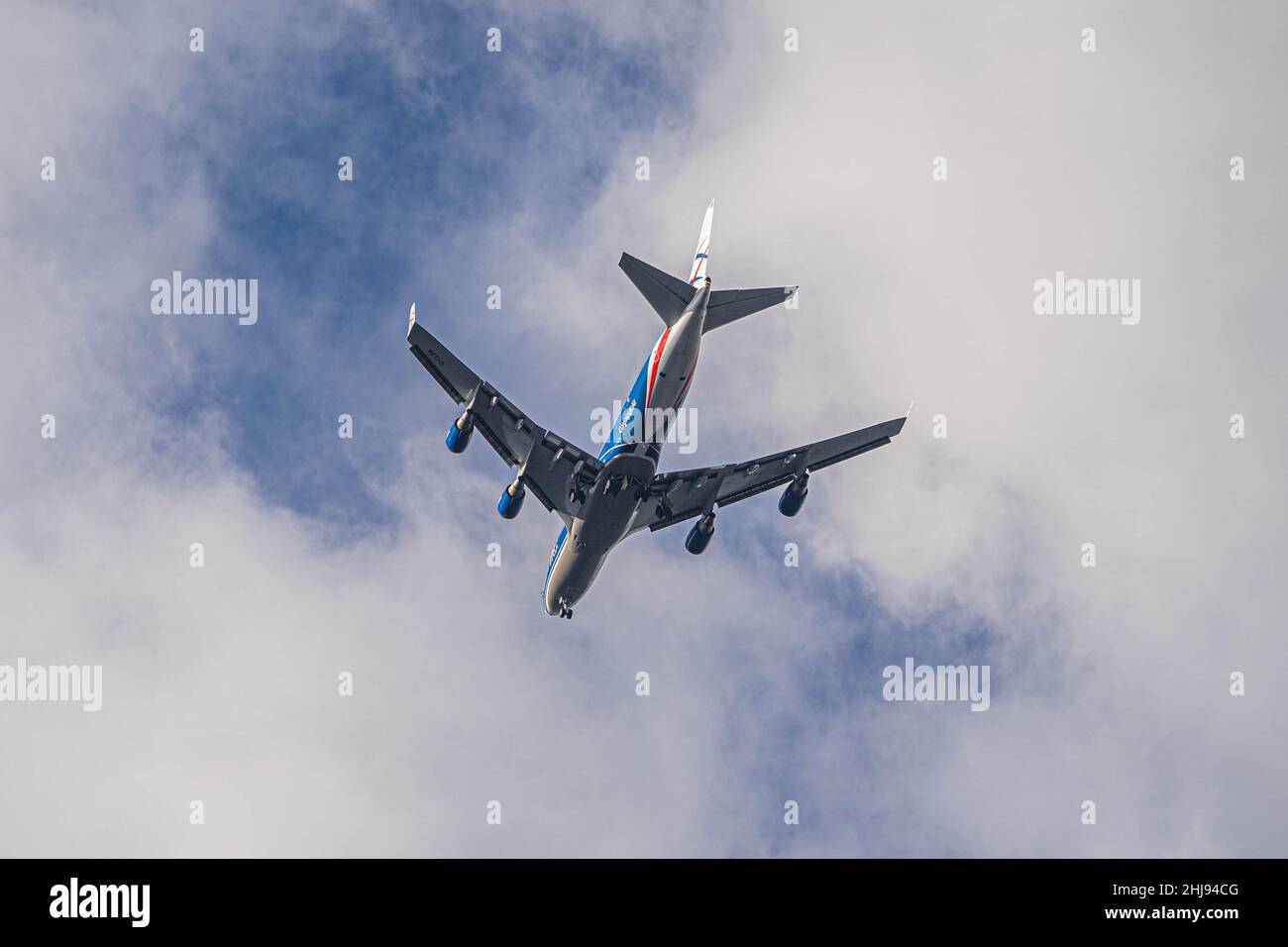 Undercarriage of airplane on final approach to landing at Heathrow ...