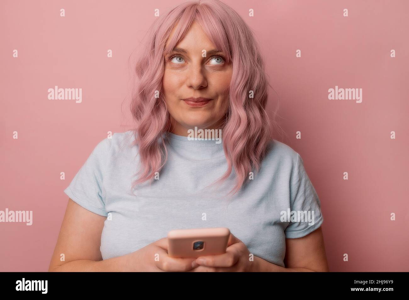 Portrait of attractive beautiful caucasian young woman thinking using ...
