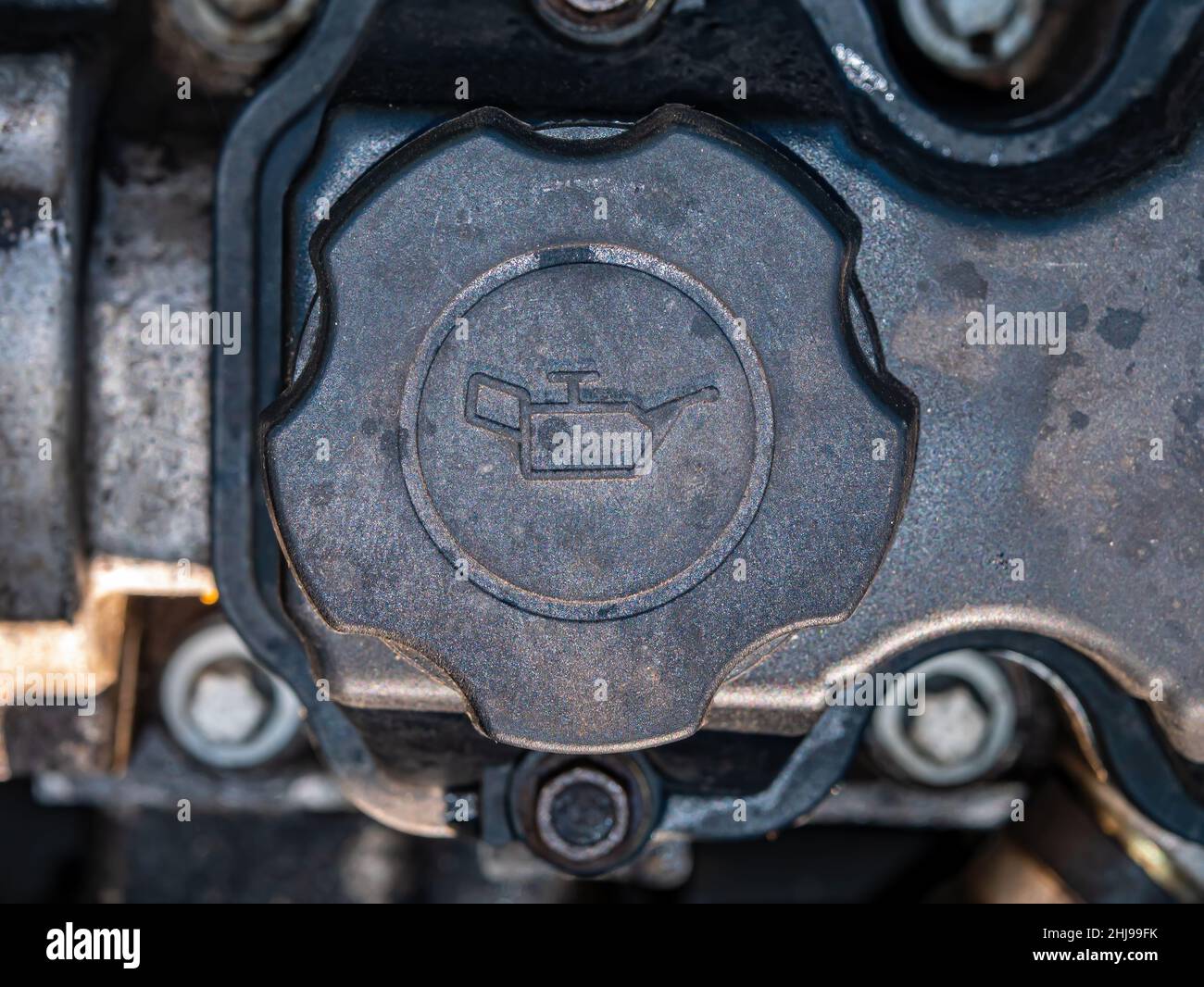 Filler cap for filling engine oil into a car engine Stock Photo - Alamy