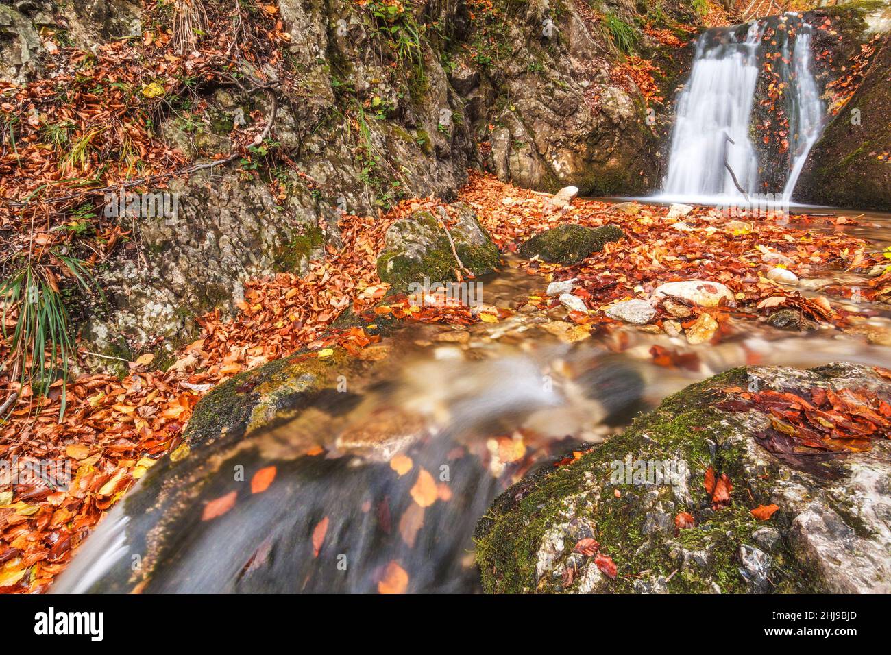 Waterfall on a stream in autumn forest, national park Mala Fatra ...