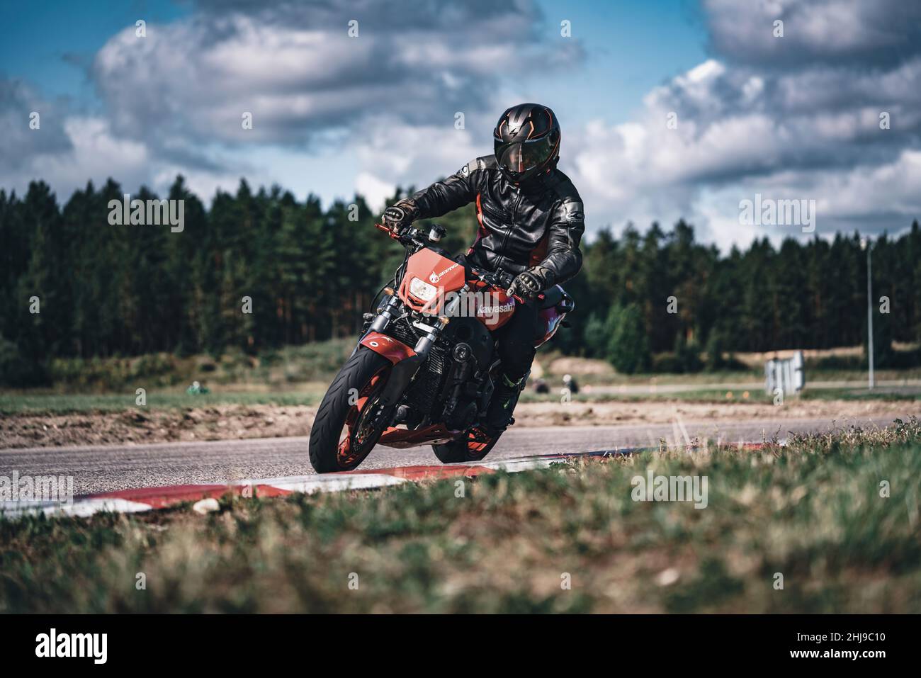 05-09-2020 Riga, Latvia Man on a motorbike on the road riding. having ...