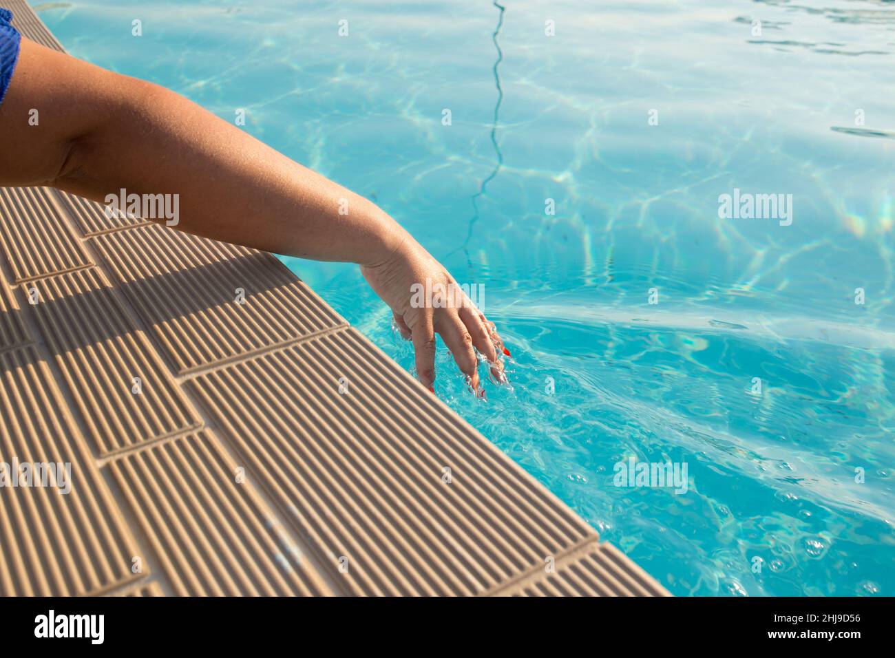 Hand closeup in swimming pool hi-res stock photography and images - Alamy