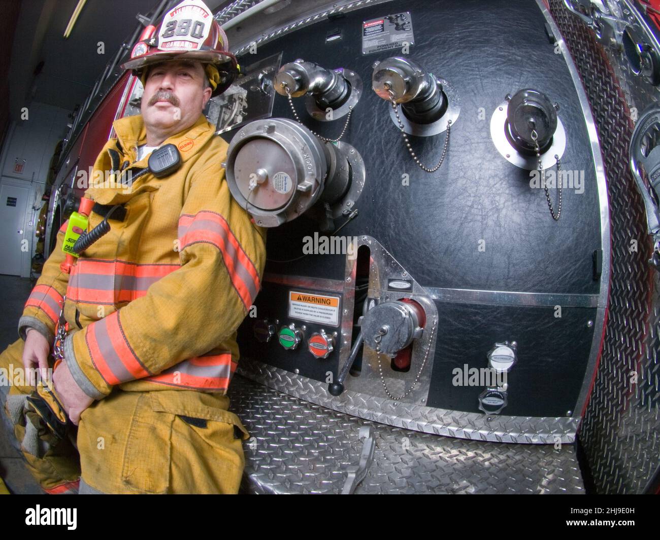 Firefighter in turnout gear Stock Photo - Alamy