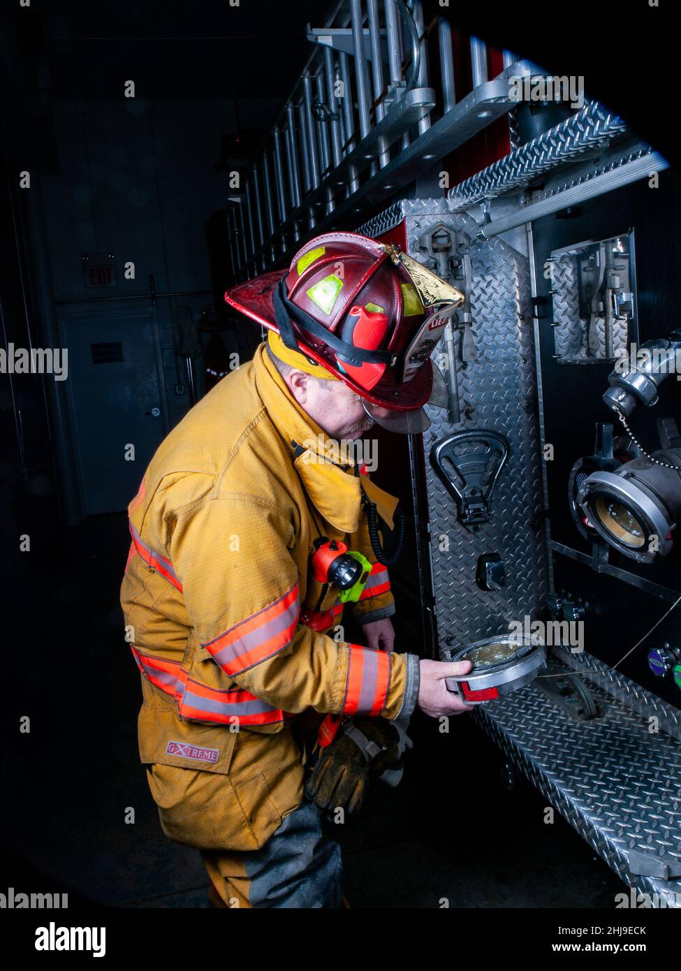 Firefighter in turnout gear Stock Photo - Alamy