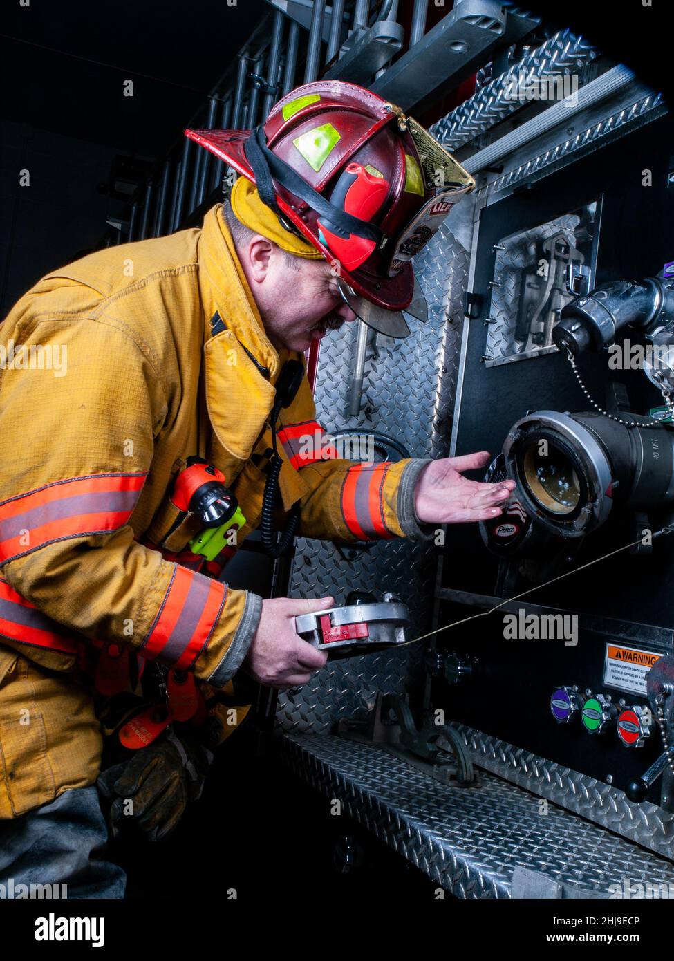 Firefighter in turnout gear Stock Photo - Alamy