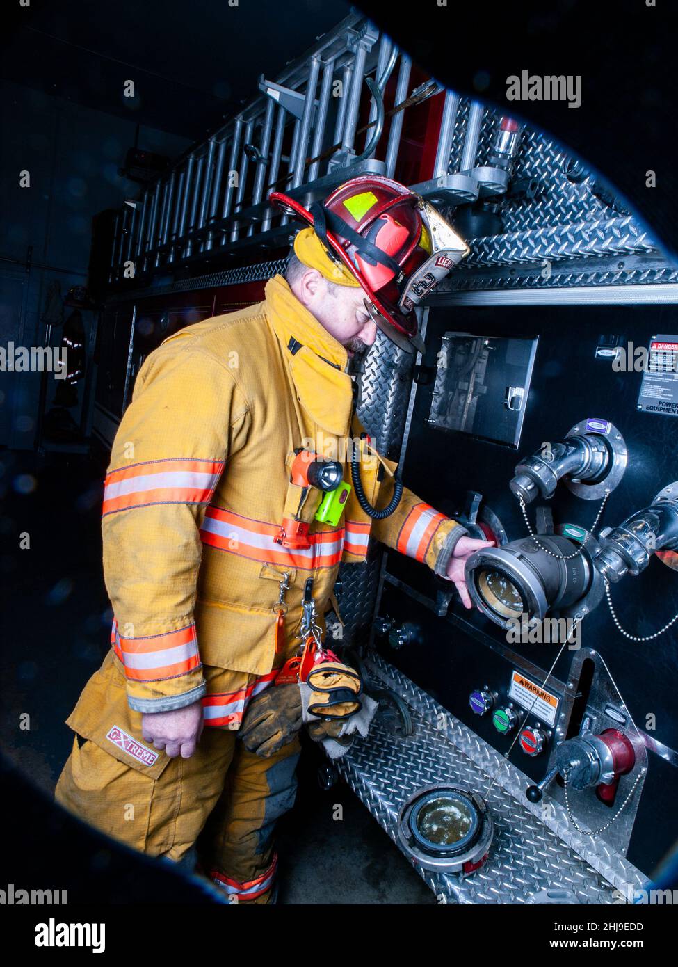 Firefighter in turnout gear Stock Photo - Alamy
