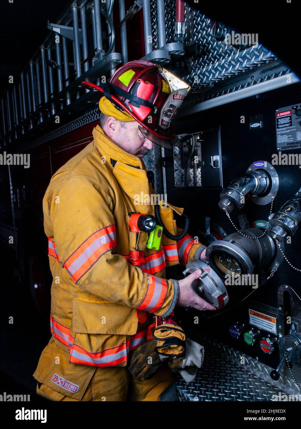 Firefighter in turnout gear Stock Photo - Alamy