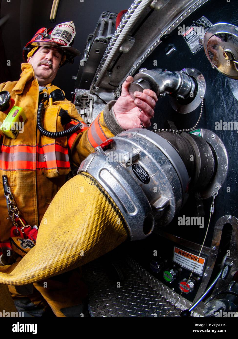 Firefighter in turnout gear Stock Photo - Alamy